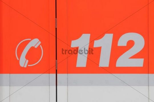Fire-brigade emergency phone number 112 on the body of a fire engin...